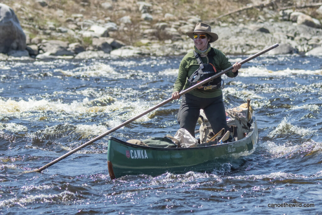Lisa DeHart poling Big Rapids - Canoe the Wild